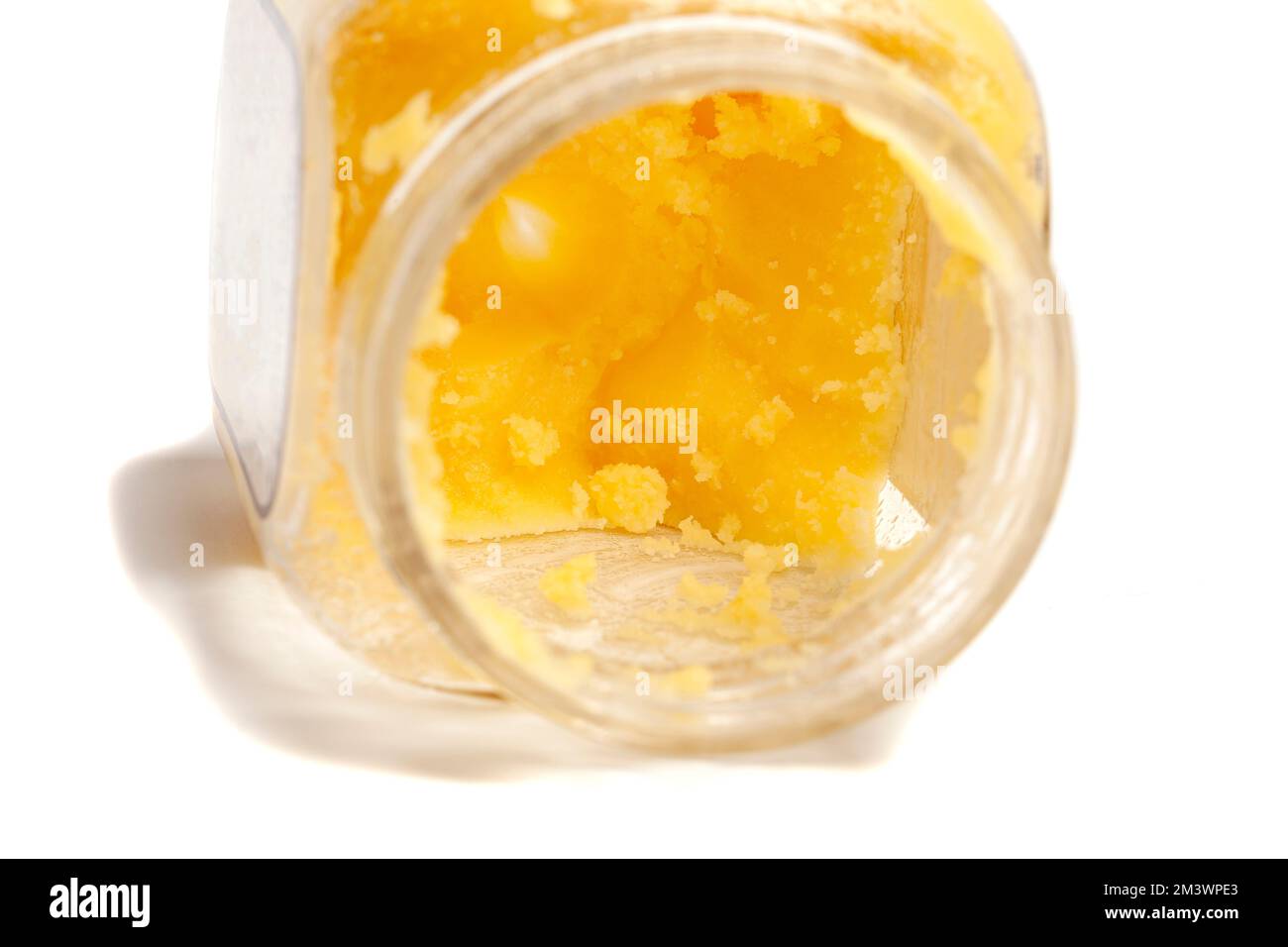 Ghee in jar isolated on white background Stock Photo - Alamy