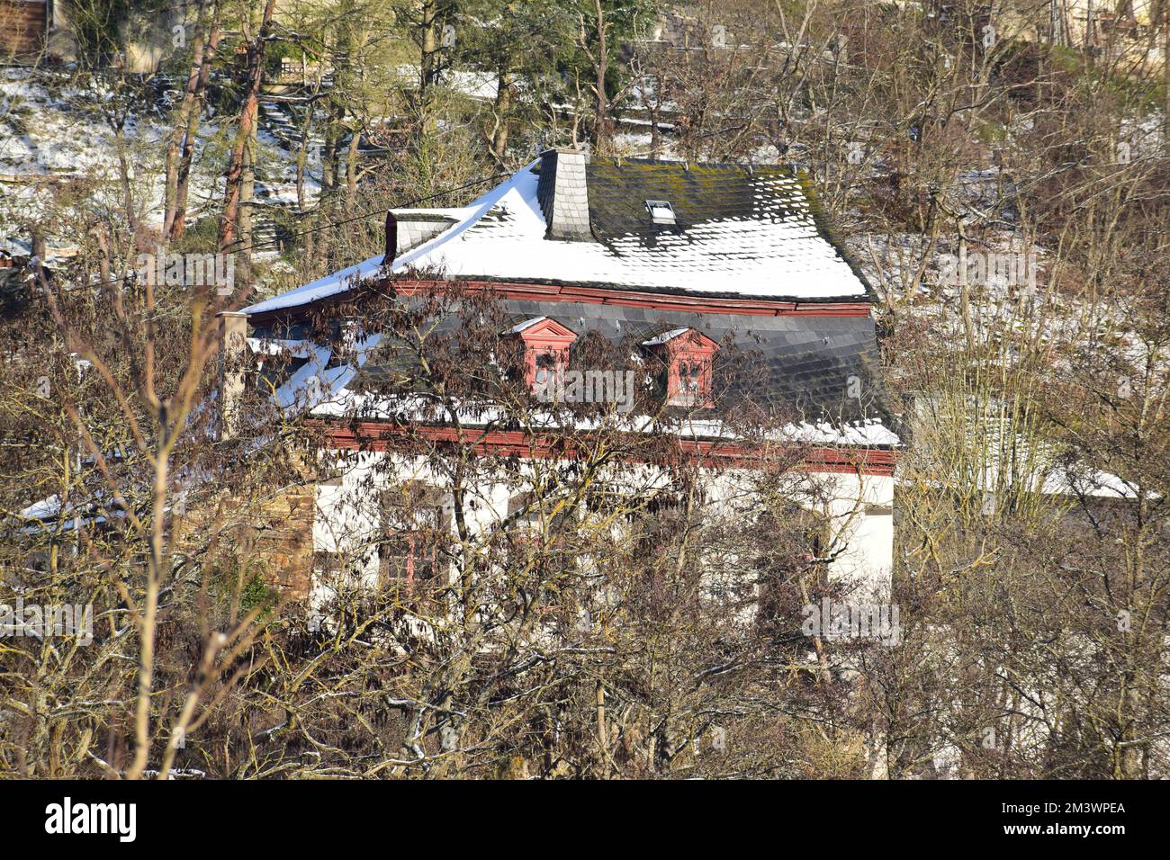beautiful old house with snow on the roof Stock Photo - Alamy