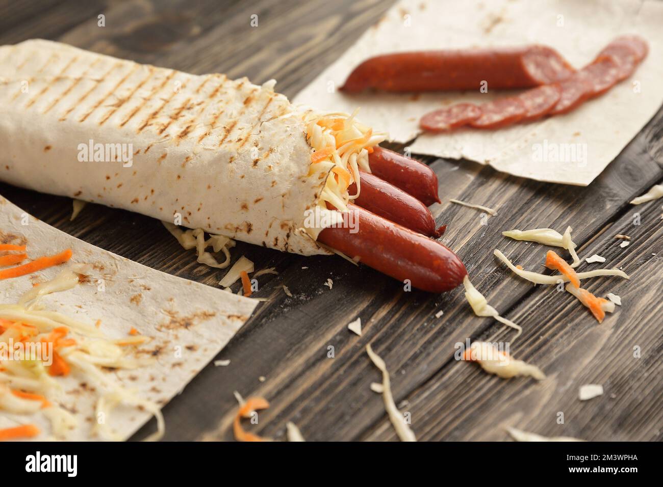 sausages in pita bread on wooden background Stock Photo - Alamy