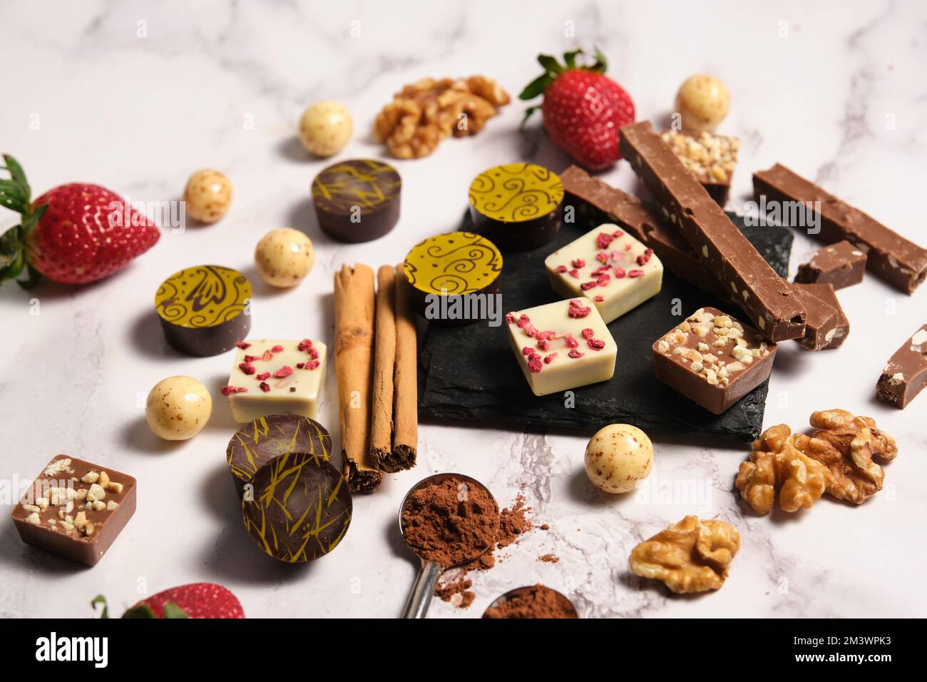a variety of chocolates on a light background Stock Photo - Alamy
