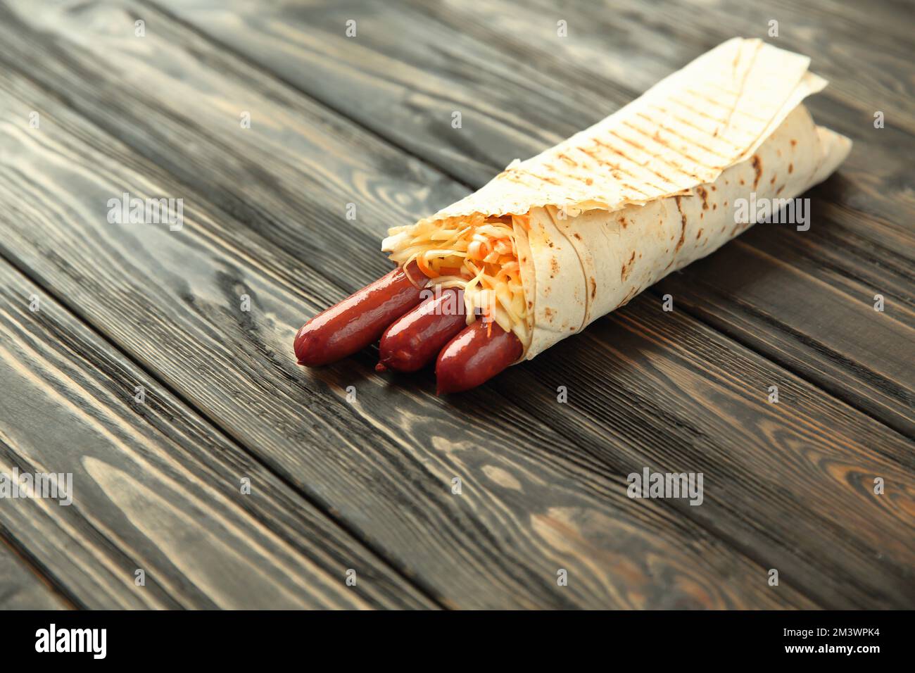 homemade sausages in pita bread on wooden background.photo with copy ...
