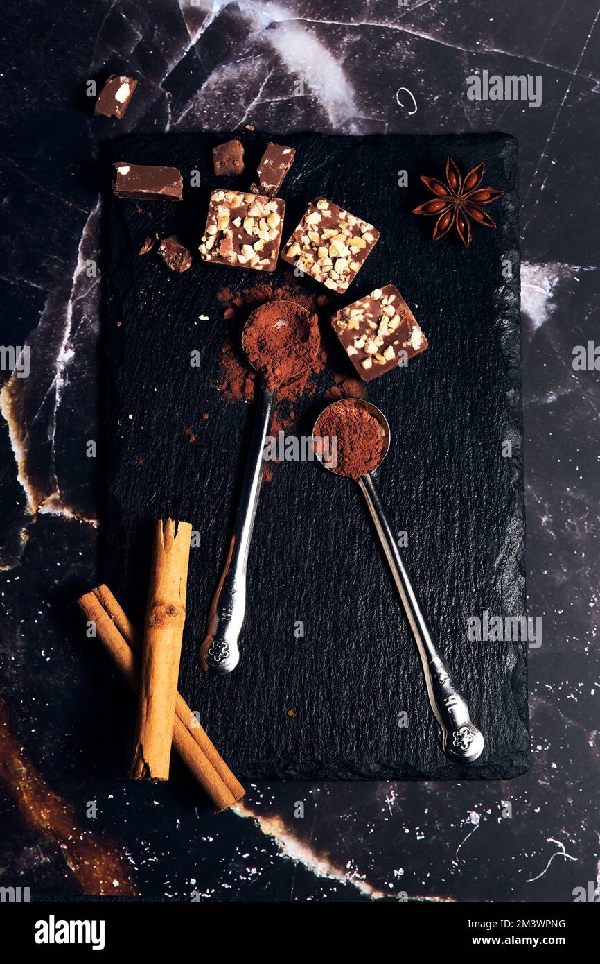 a variety of chocolates on a dark background Stock Photo - Alamy