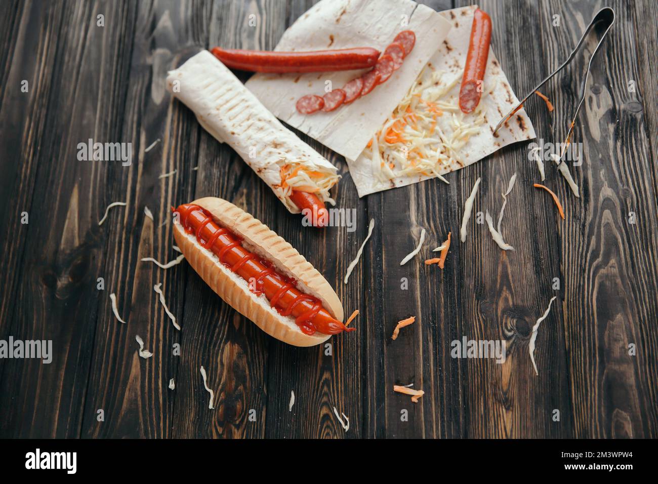 fast food.hot dogs with sauce on wooden background Stock Photo - Alamy