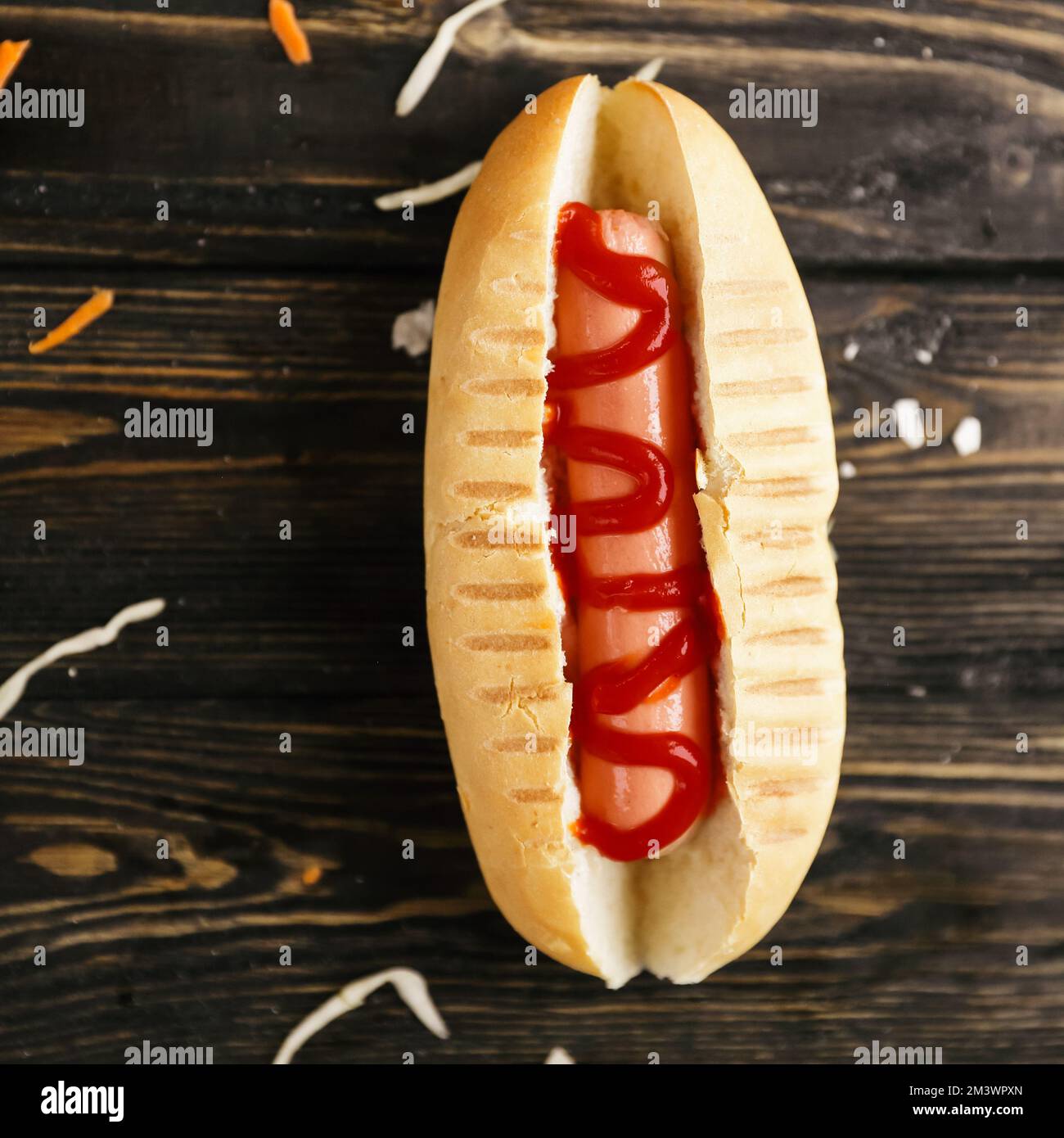 hot dog and pickled cabbage on dark wooden background.photo with copy ...