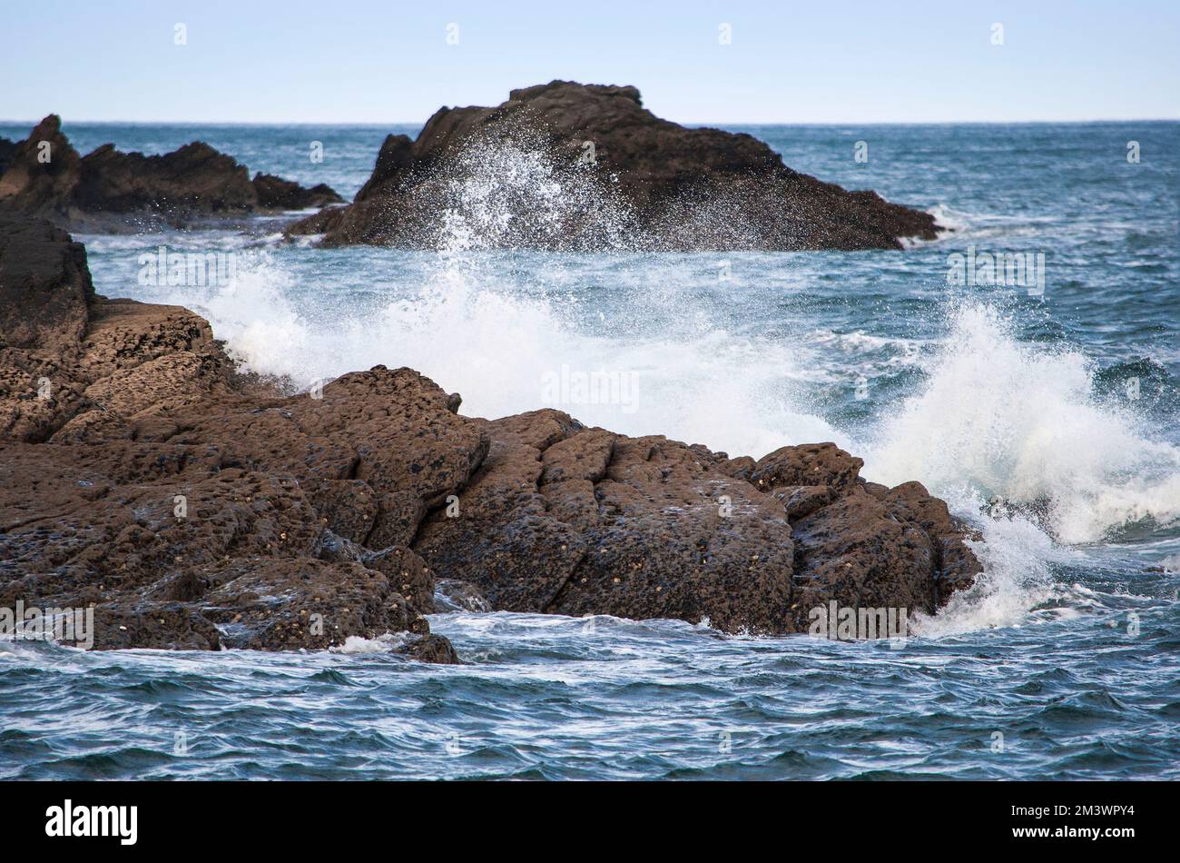 Ocean waves crashing against rocks at Mundaka. Basque country, Spain ...