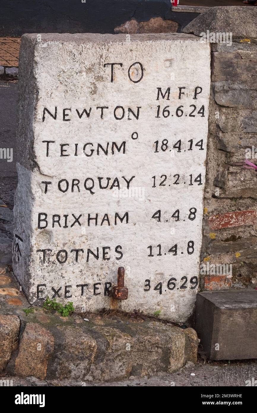 Old Mile stone showing distances to towns in Devon Stock Photo - Alamy