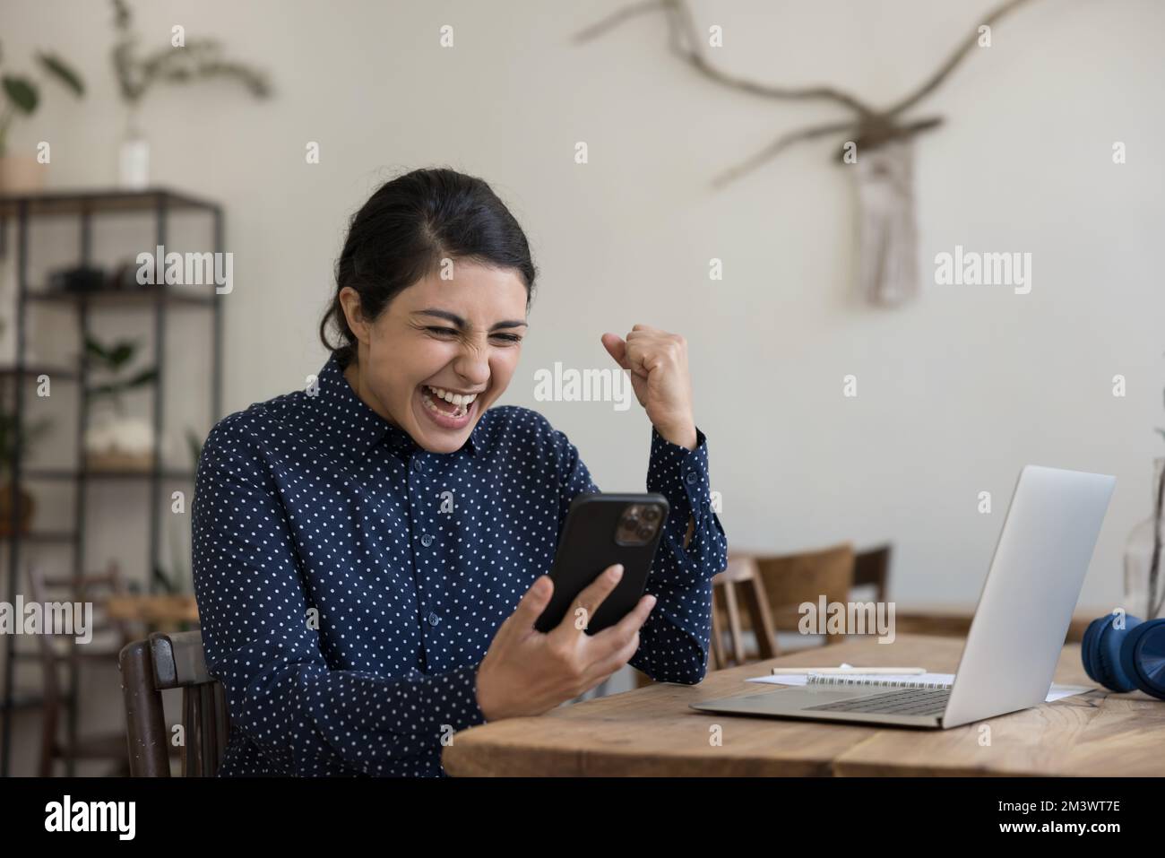 Excited young indian woman celebrating hi-res stock photography and ...