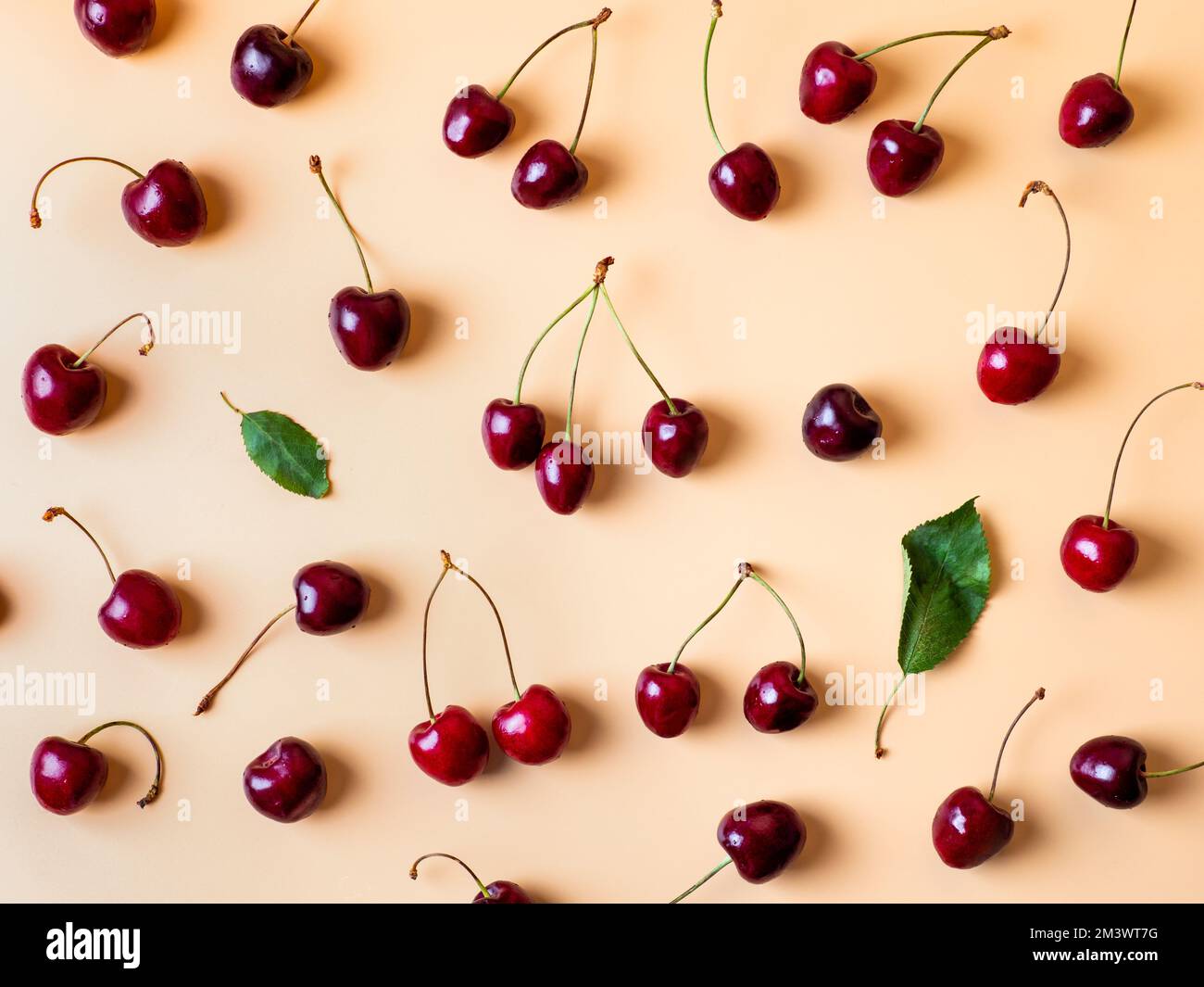 Fresh cherries scattered on yellow background. Creative fresh cherry ...