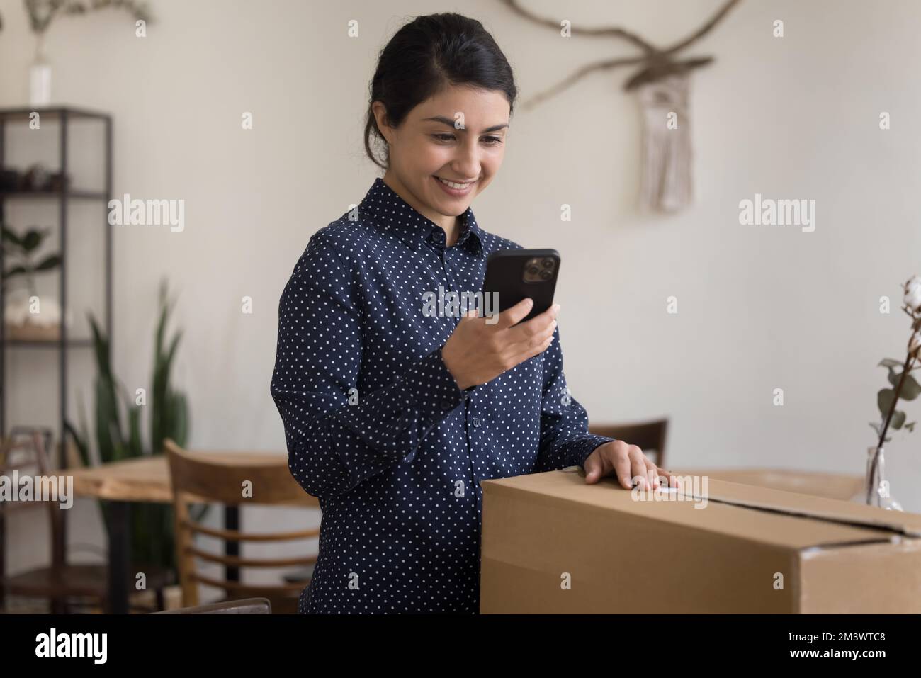 Happy pretty Indian woman sending parcel, packing cardboard box Stock ...