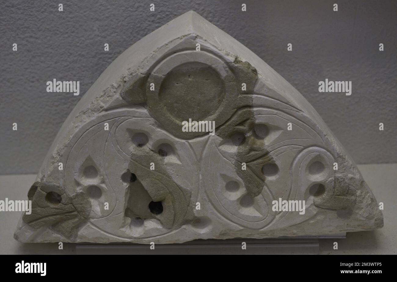 Fragment of plasterwork. Flamboyant tracery with circles and fish ...