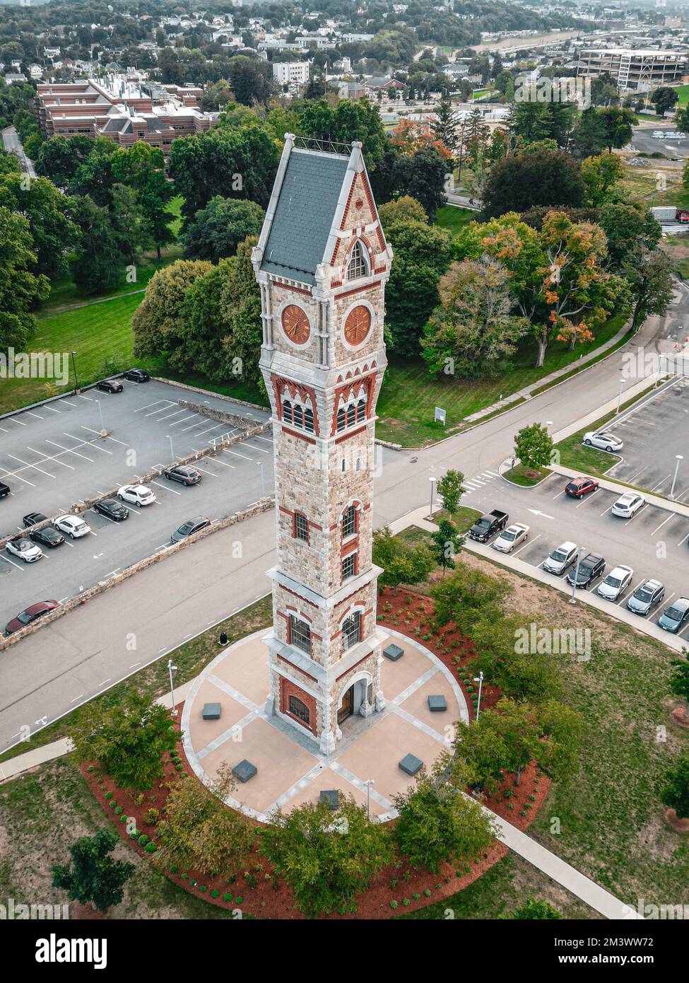 A vertical aerial shot of the Clock Tower in front of a parking lot in ...