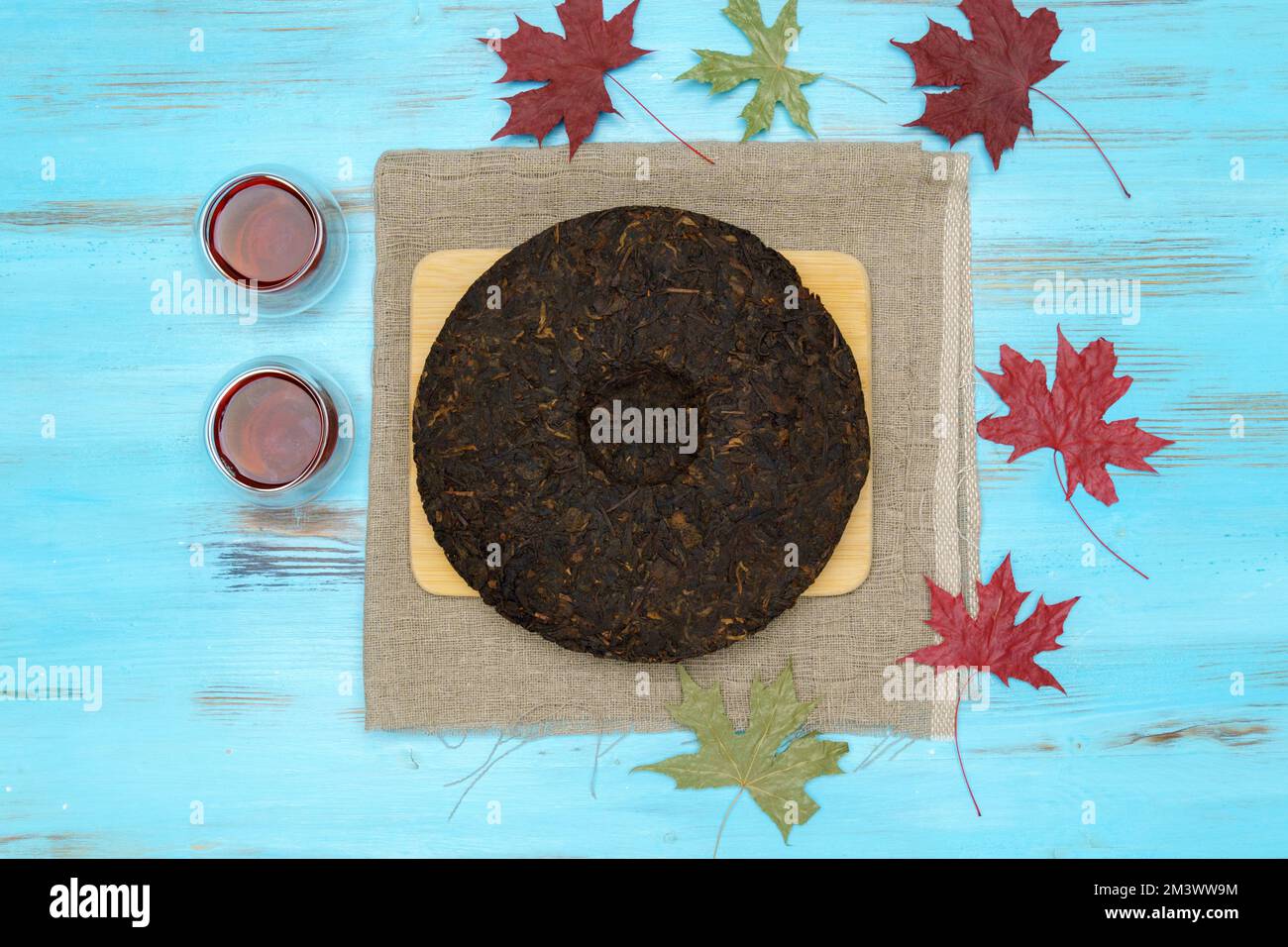 Chinese tea ceremony pressed pu erh blue wooden table top view morning ...