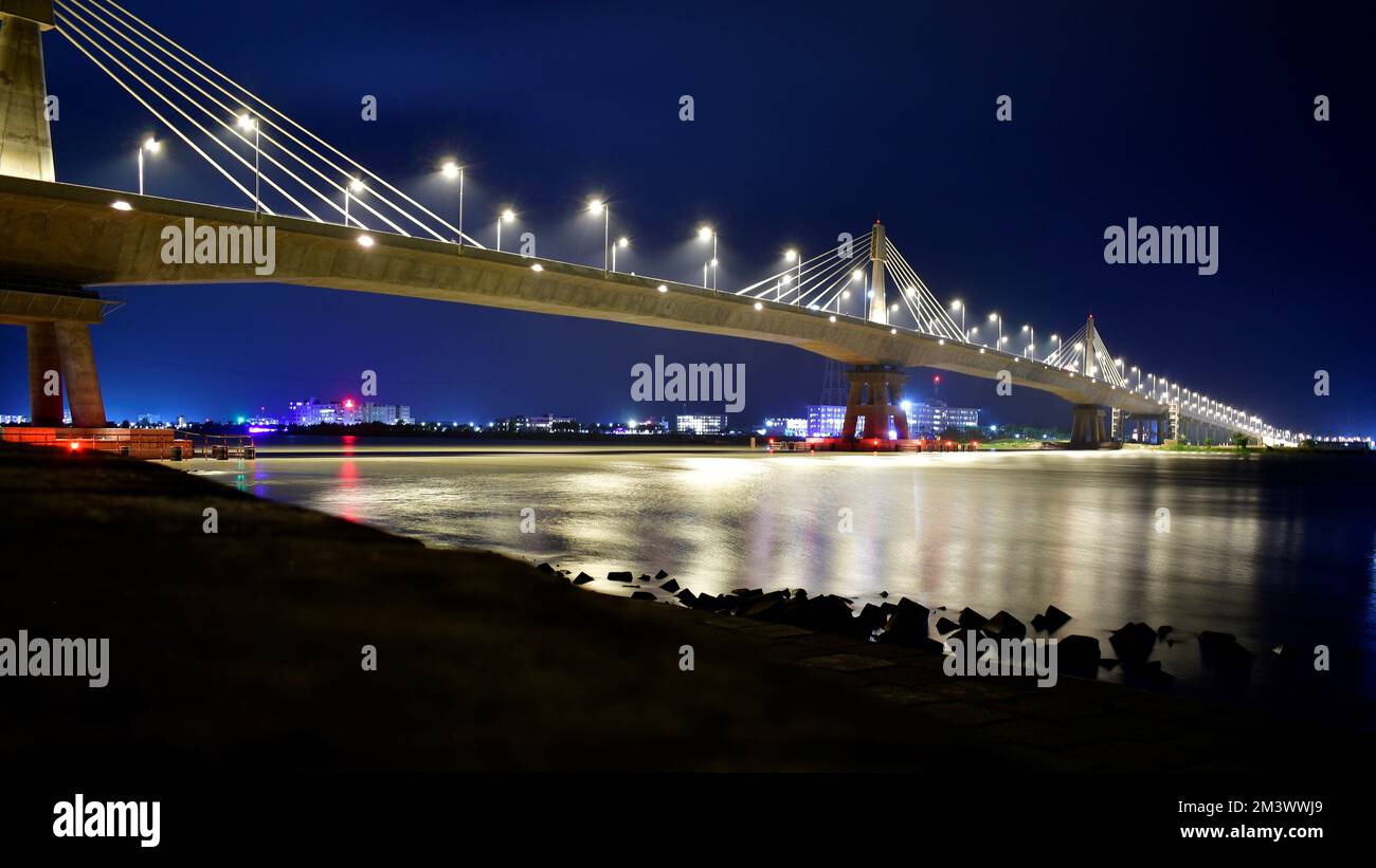 Iconic Payra bridge illuminates at night over River Payra in Bangladesh ...