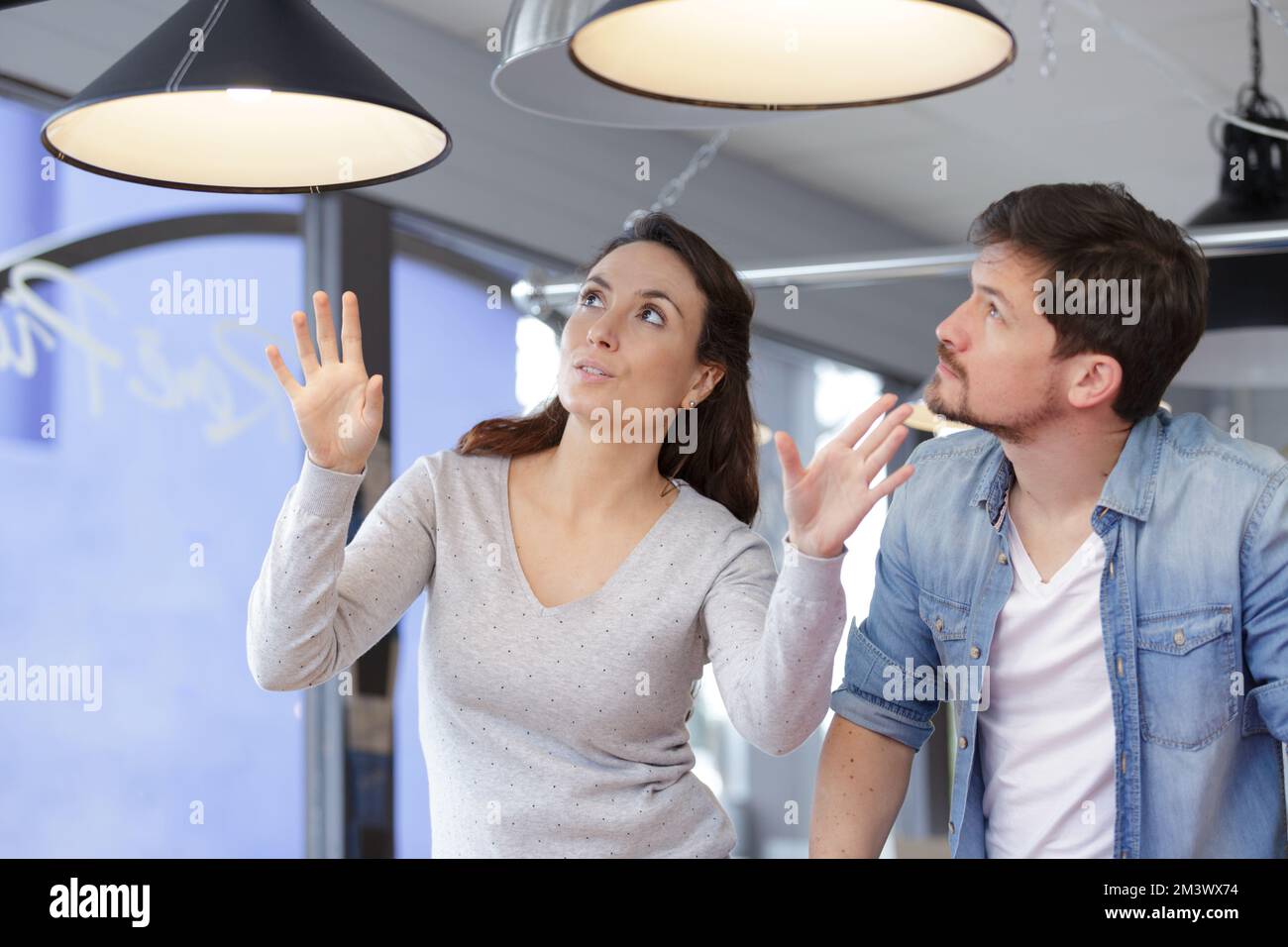 customers in electrical good department Stock Photo - Alamy