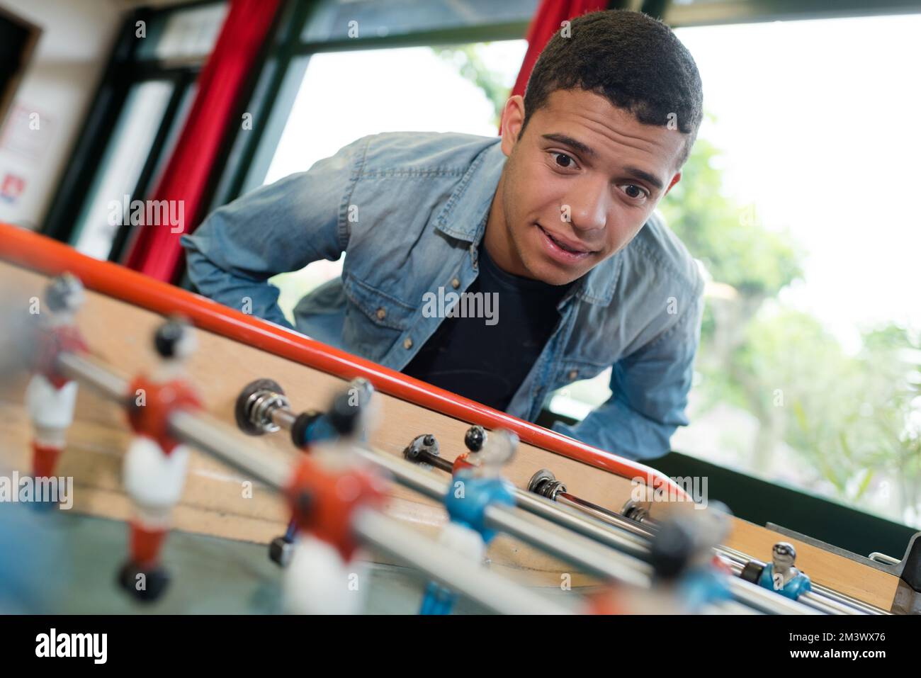Hand and foosball table hi-res stock photography and images - Alamy