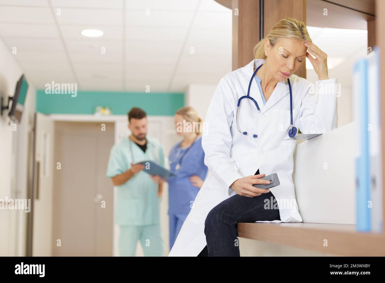 Stressed female doctor hi-res stock photography and images - Alamy