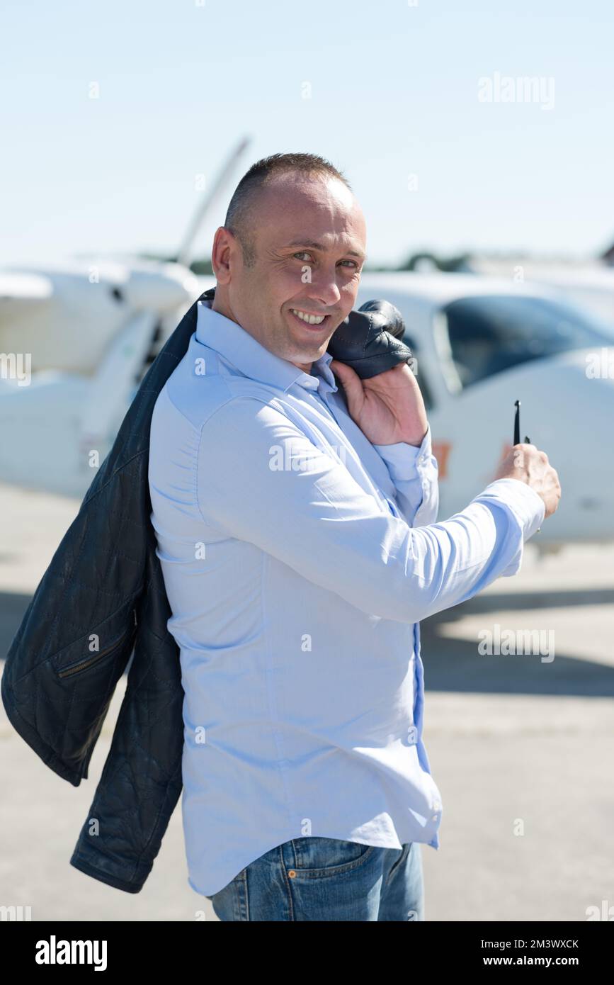 a pilot near an airplane Stock Photo - Alamy