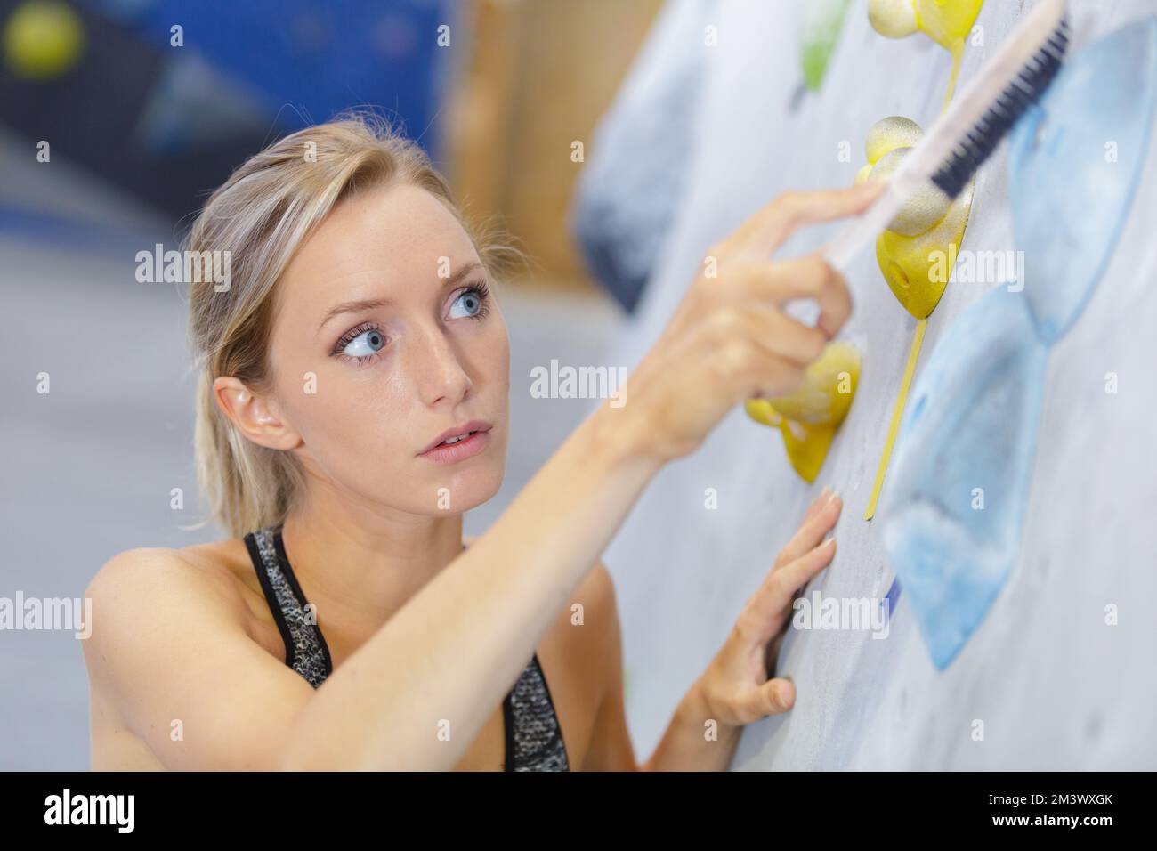 wall climbing center worker cleaning Stock Photo - Alamy