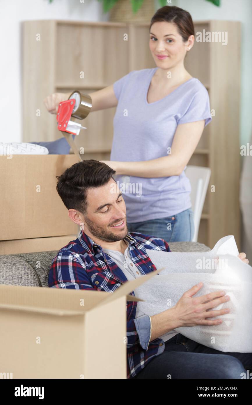 family preparing box for relocation Stock Photo - Alamy