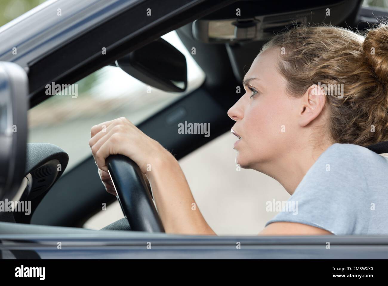 stressed woman driving a car Stock Photo - Alamy