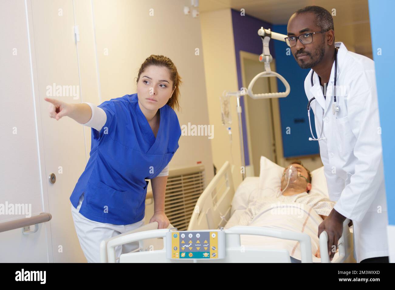 Transferring patient hospital bed hi-res stock photography and images ...