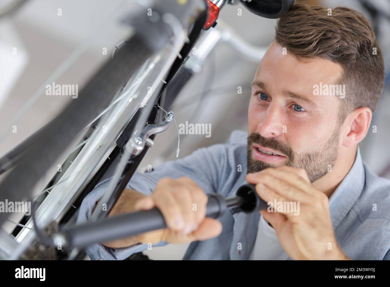Man inflating bicycle tire pump hi-res stock photography and images - Alamy