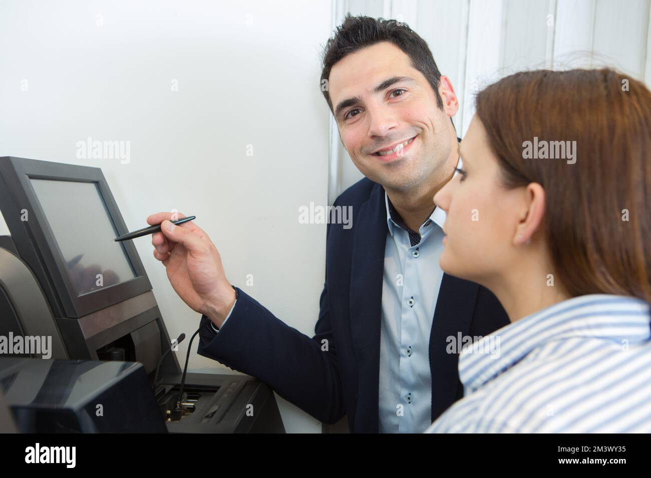 happy banker assisting female customer Stock Photo - Alamy
