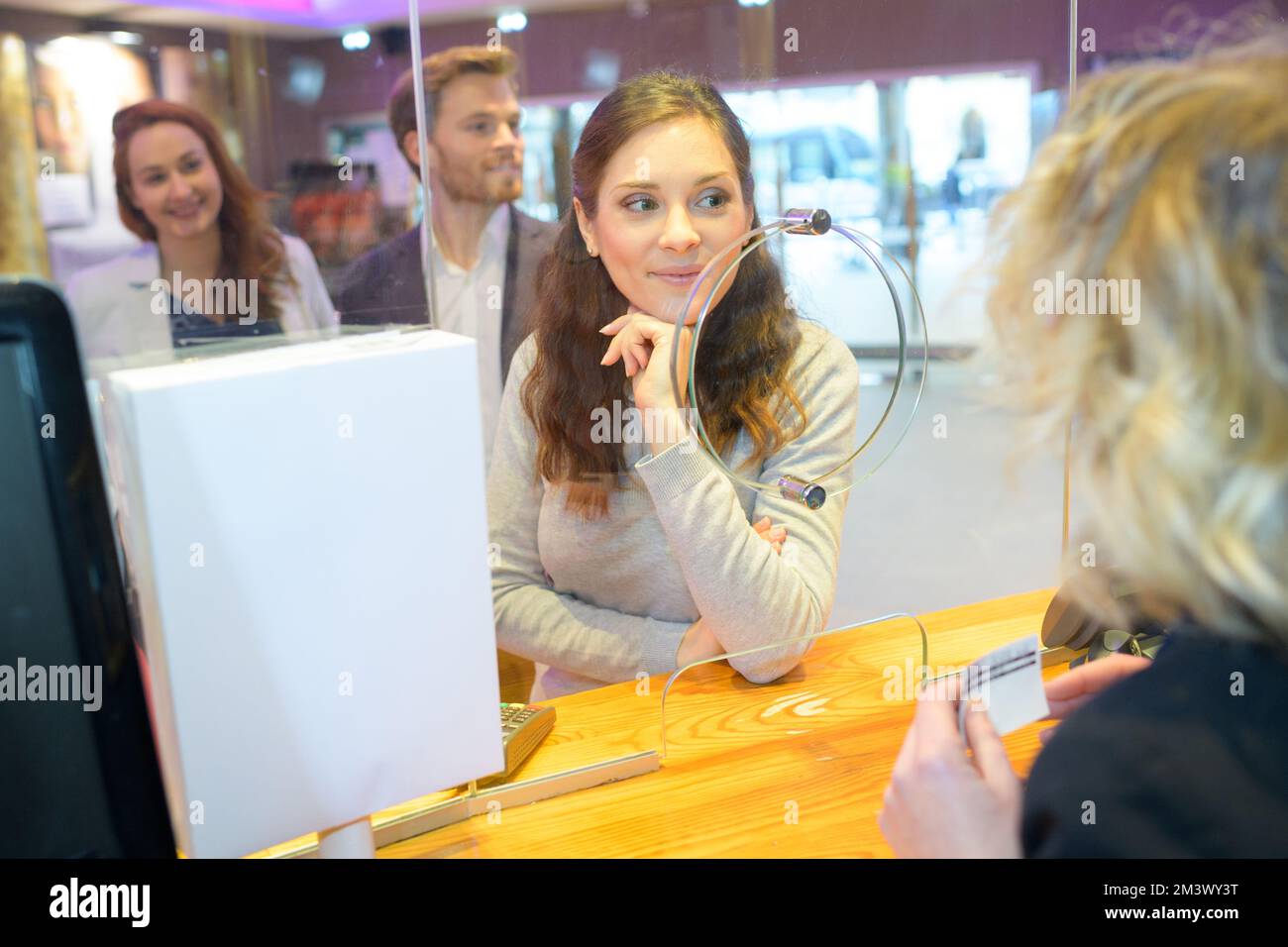 woman buying a movie ticket Stock Photo - Alamy