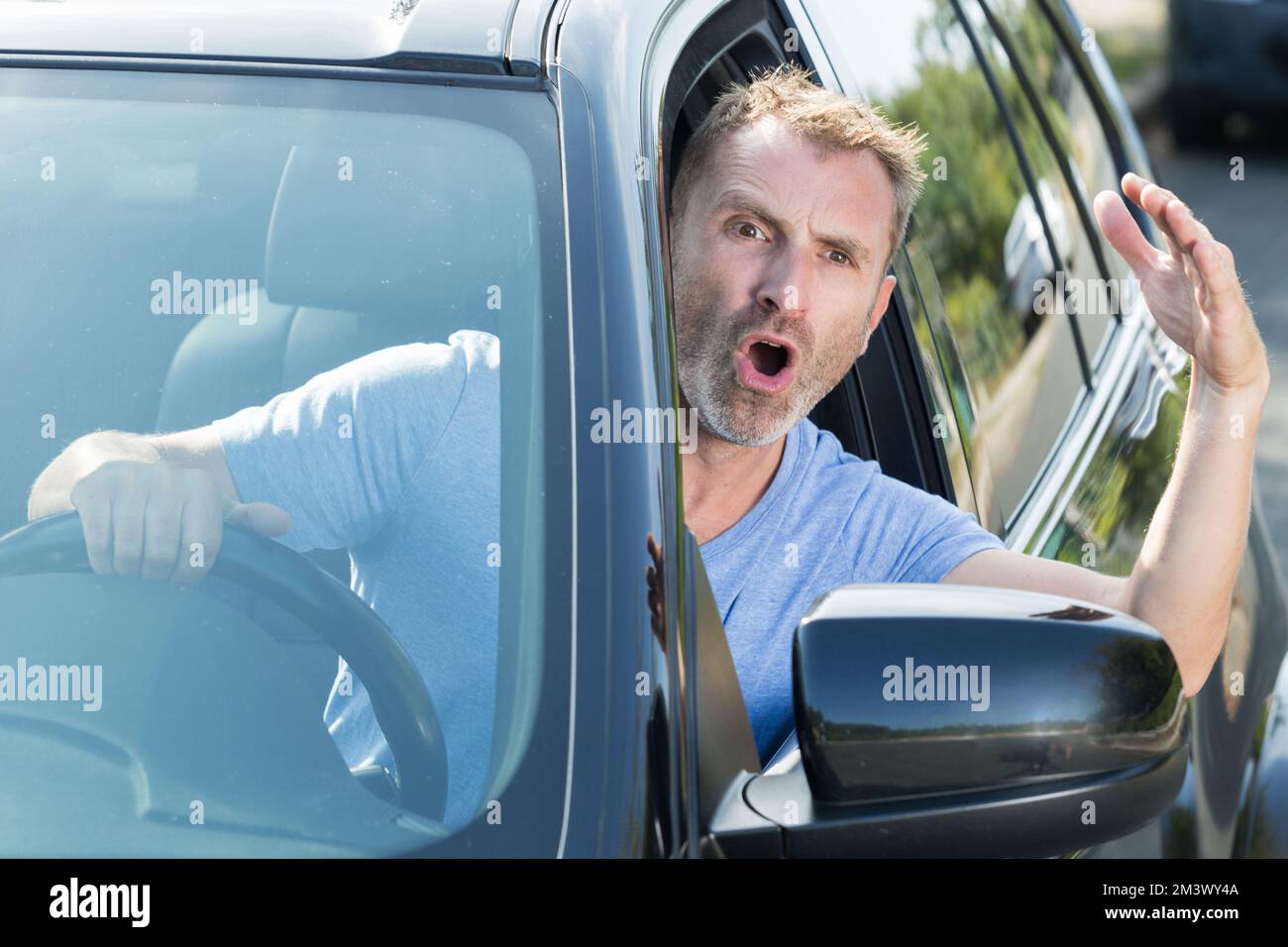 angry man driving a car Stock Photo - Alamy