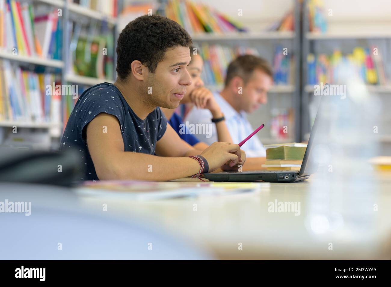 one college student study in the library with laptop Stock Photo - Alamy