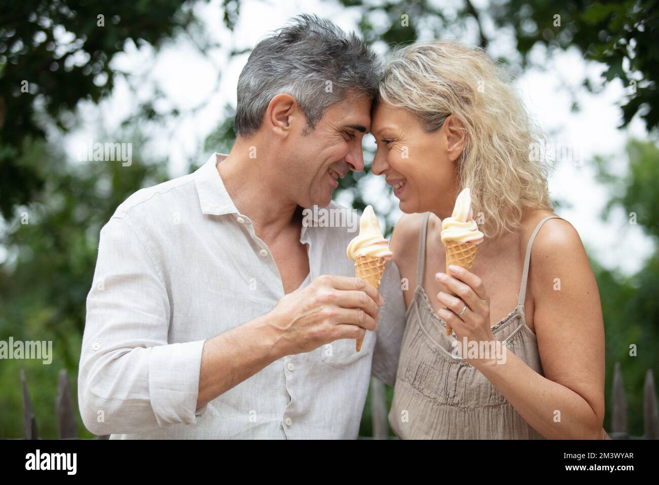 happy old couple eating ice-cream outdoor Stock Photo - Alamy