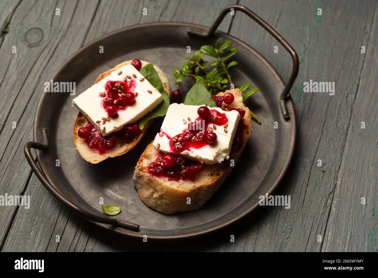 Sandwiches with goat cheese, lingonberry jam and flax seeds Stock Photo ...