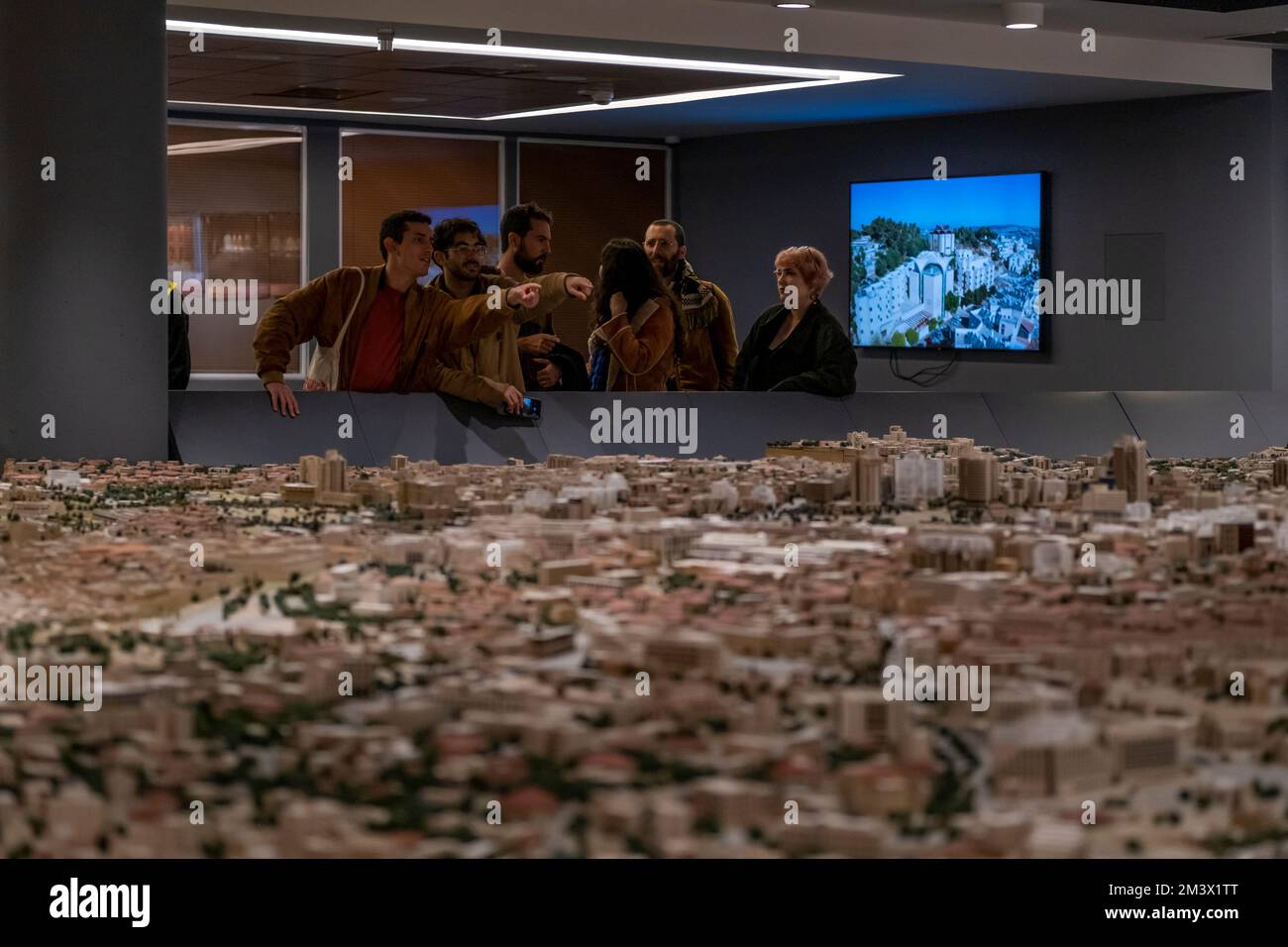 Visitors view a 3D scale model of Jerusalem which enables viewers to ...