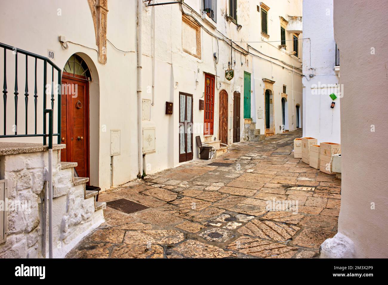 Apulia Puglia Italy. Ostuni. The white town. The narrow alleys of the ...