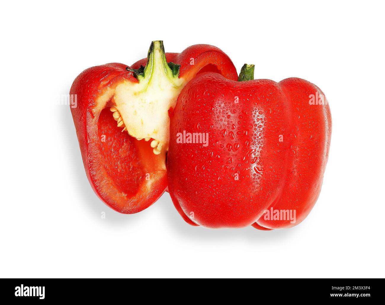 ripe red pepper cut in half on a white background Stock Photo - Alamy