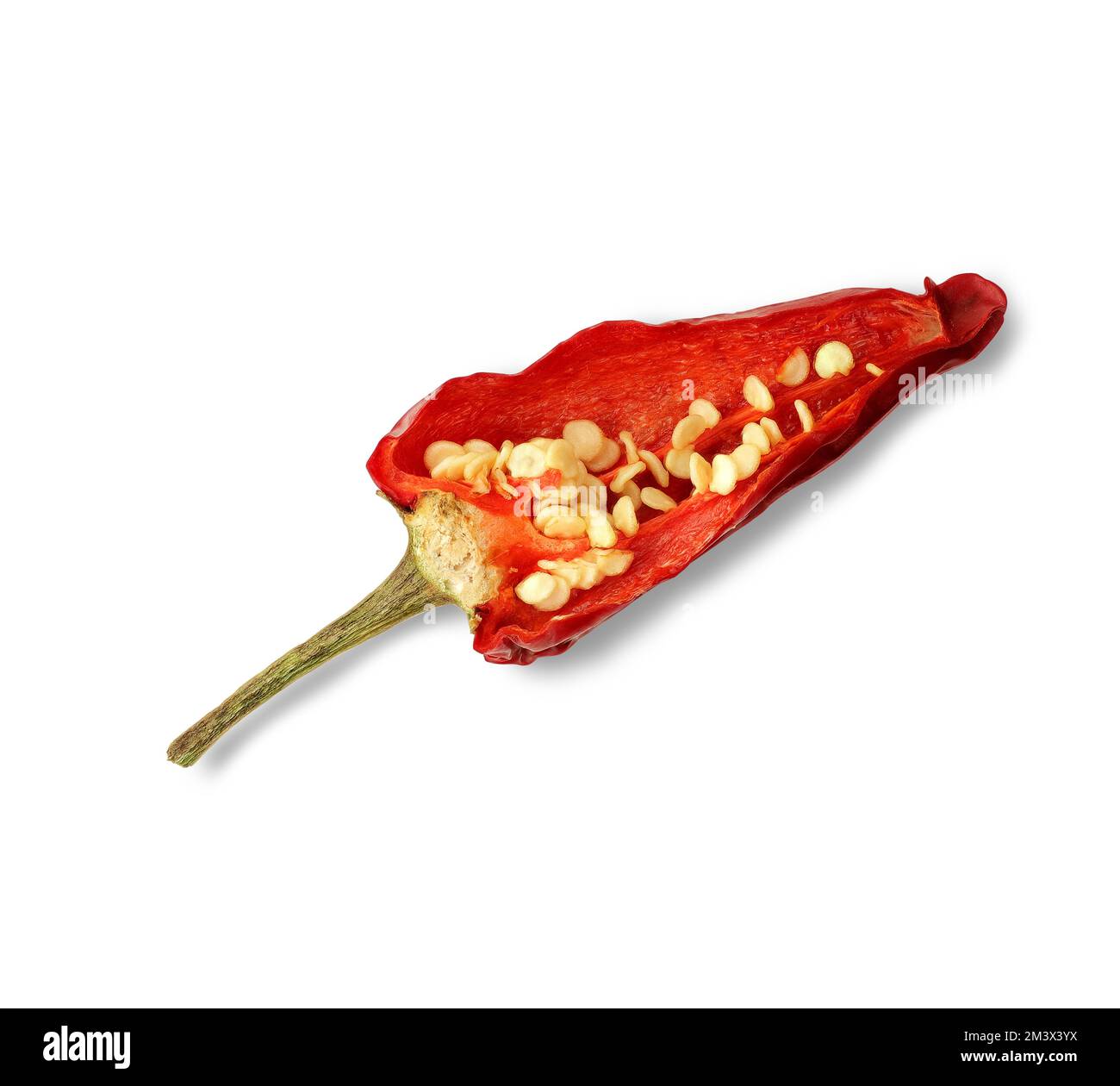 a chili pepper cut in half with the seeds on a white background Stock ...