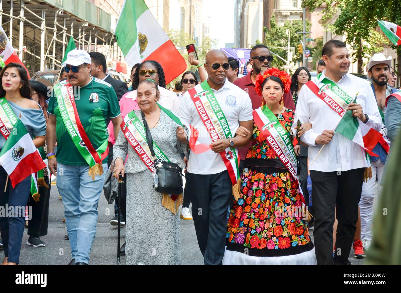 A group of people with flags marching during the Independence Day ...