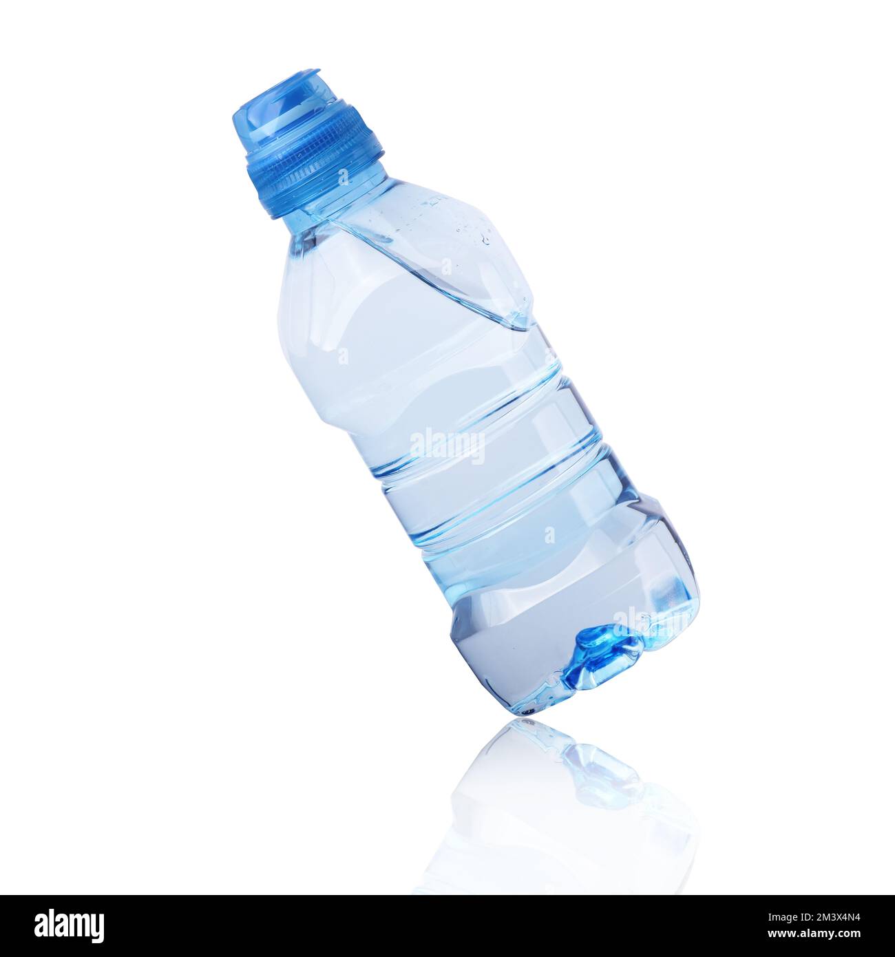 inclined plastic bottle with mineral water isolated on white background Stock Photo - Alamy