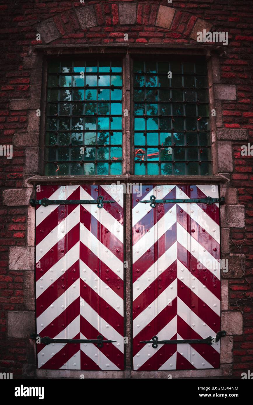 Old vintage windows with small square tiles above windows shutters ...