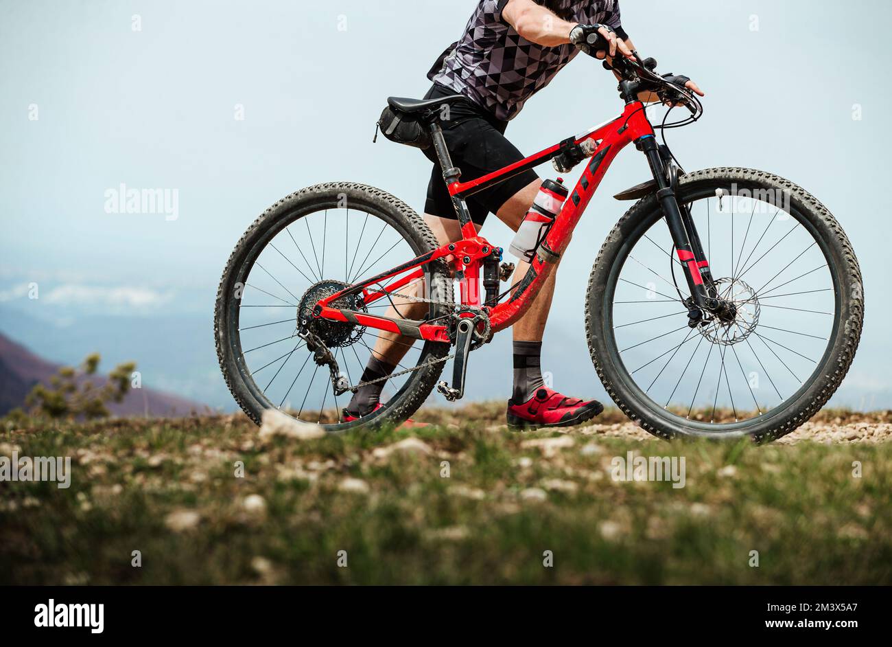 athlete walking with his mountainbike hard climb uphill Stock Photo - Alamy