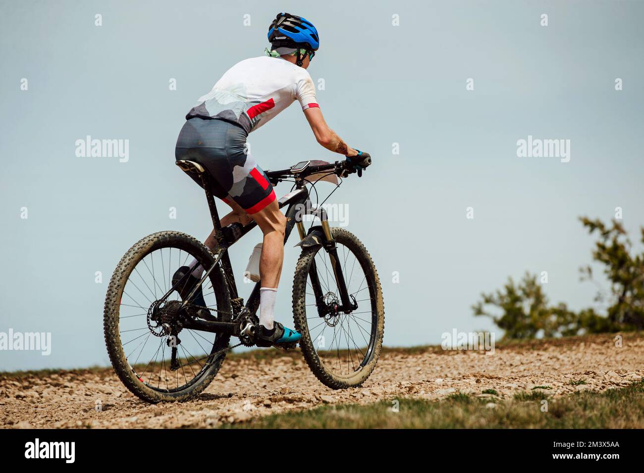 male athlete on mountainbike riding gravel trail Stock Photo - Alamy