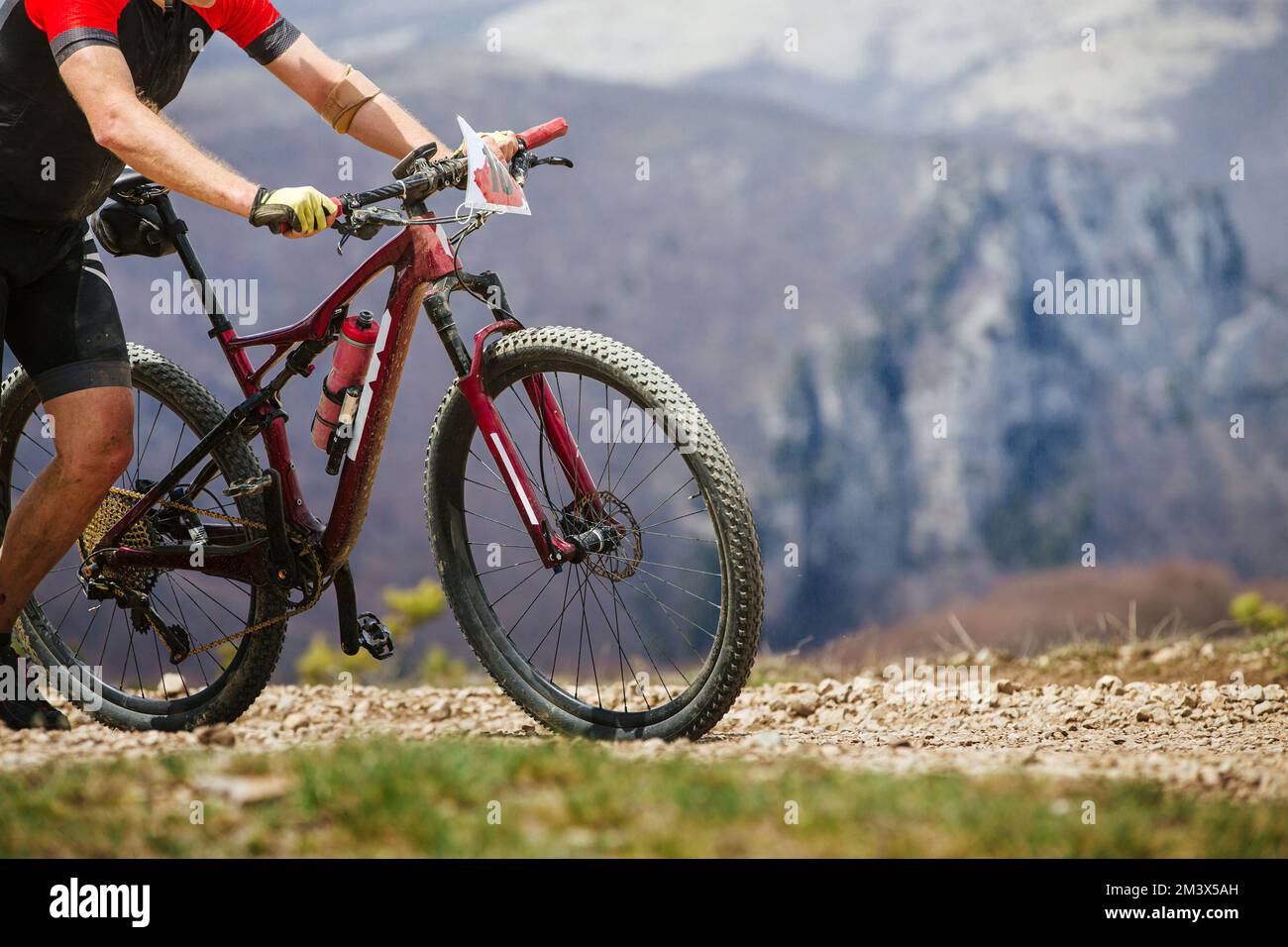 athlete walking with his mountainbike hard climb uphill Stock Photo - Alamy
