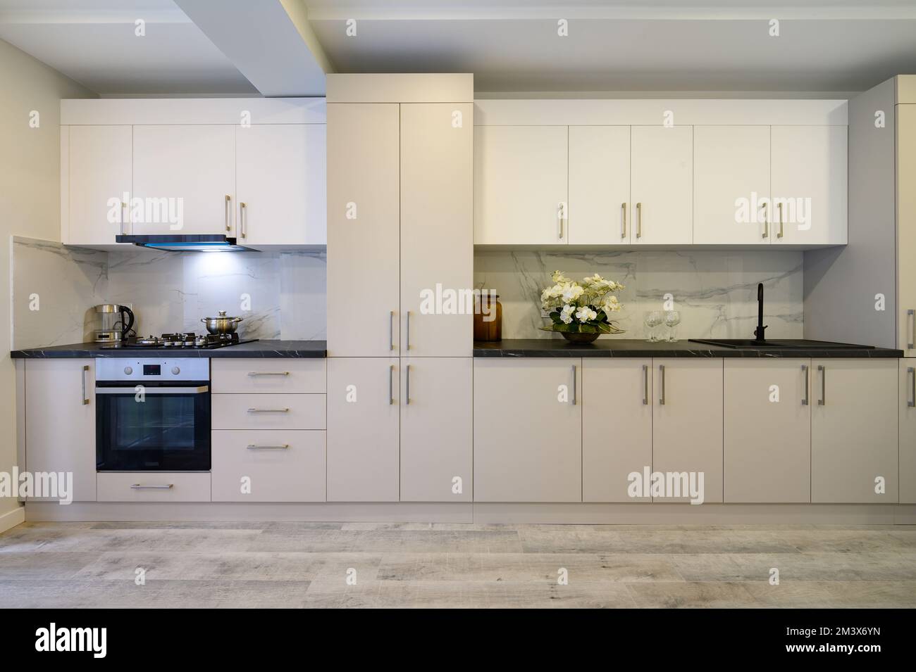 Large beige and cream luxury kitchen interior, front view to furniture ...