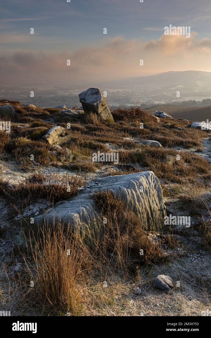Frost covered rocks on the moors overlooking Burley-in-Wharfedale in ...