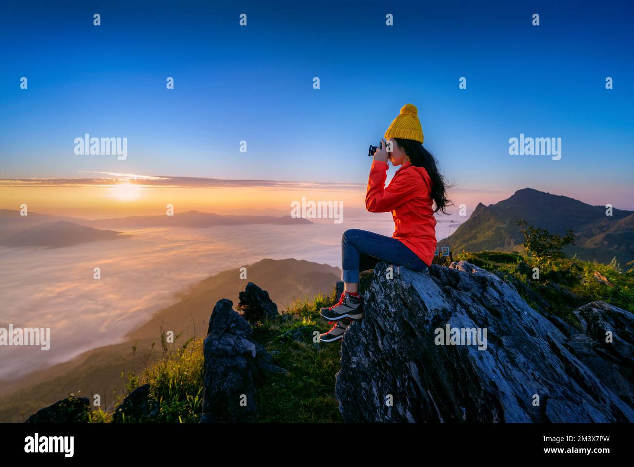 Tourist taking photo at Doi pha tang mountains, Chiang Rai, Thailand ...