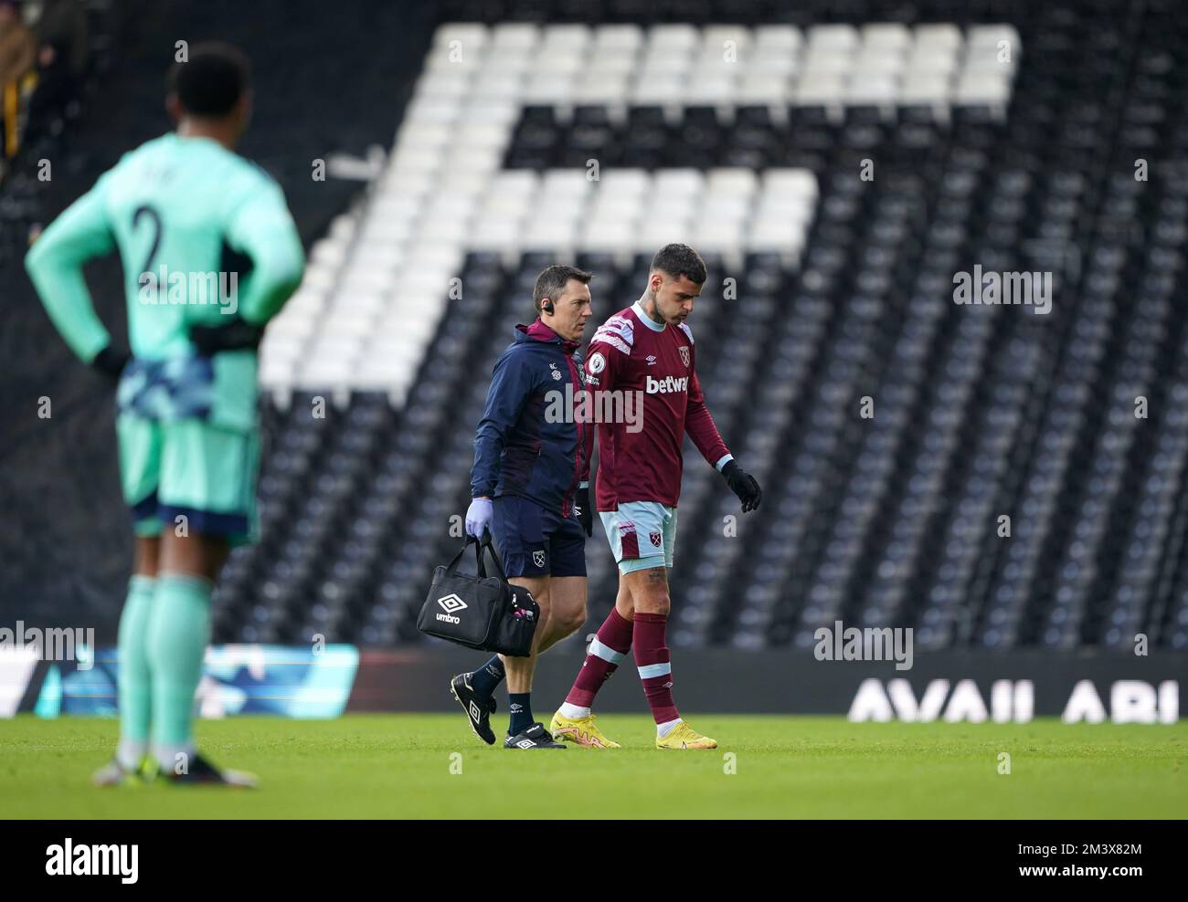 West Ham United's Gianluca Scamacca leaves the pitch after picking up ...
