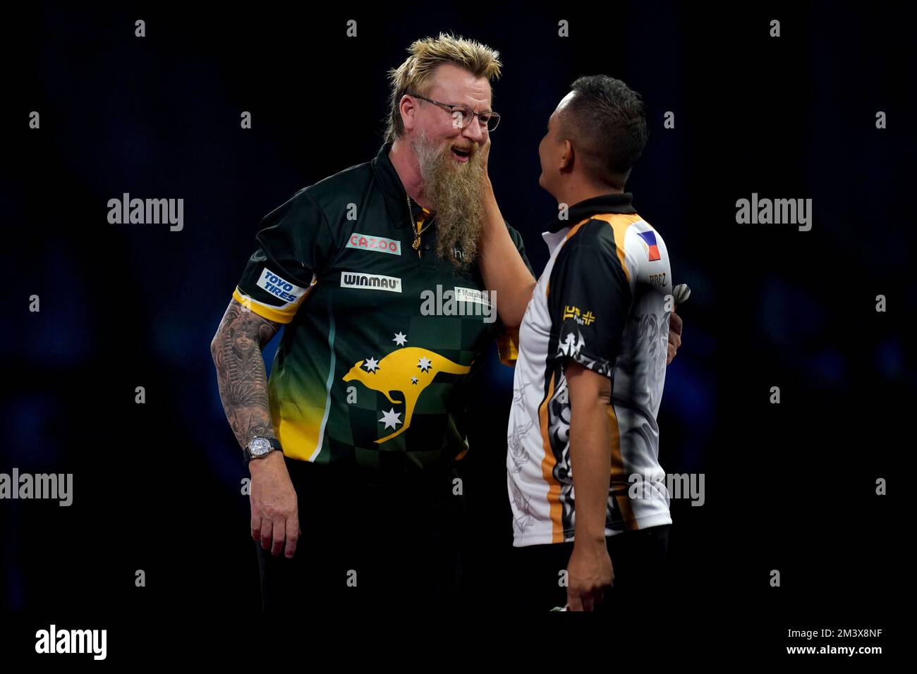 Simon Whitlock (left) is congratulated on his victory by Christian ...