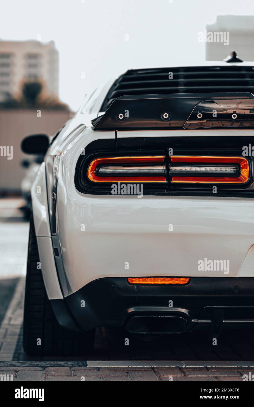 A vertical rear view of a Dodge Hellcat supercar with orange breaks ...