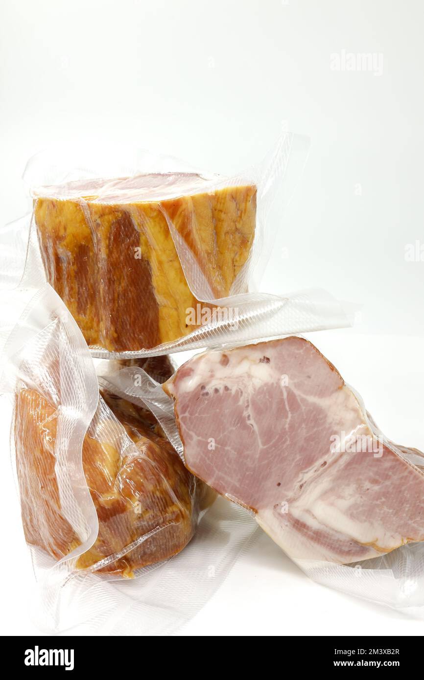 Smoked pork in vacuum packaging. Selective focus with shallow depth of ...