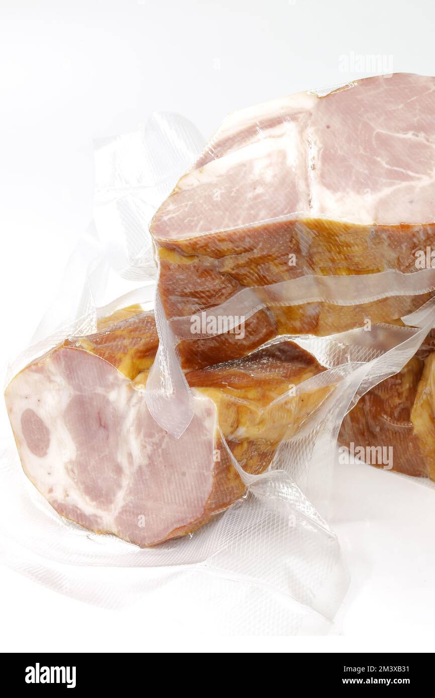 Smoked pork in vacuum packaging. Selective focus with shallow depth of ...